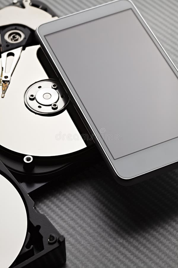 Open Hard Disk Drive with Silver Plate and Cell Phone on Carbon Fiber ...