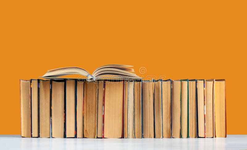 Open Hardback Book, Diary, Fanned Pages on Stack of Books on White ...