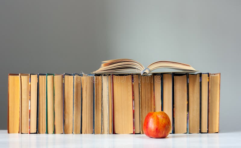 Open Hardback Book, Diary, Fanned Pages on Stack of Books on White ...