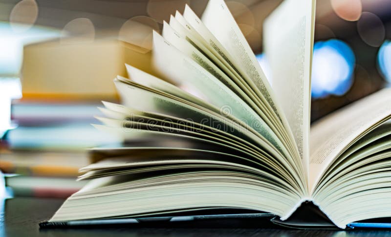 An Open Hardcover Book on a Table in a Public Library Stock Image ...