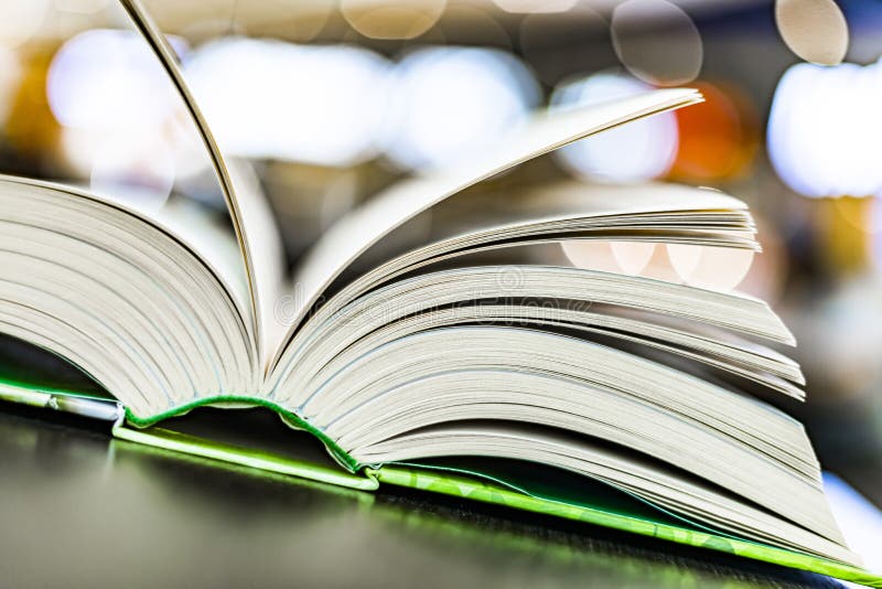 An Open Hardcover Book on a Table in a Public Library Stock Image ...