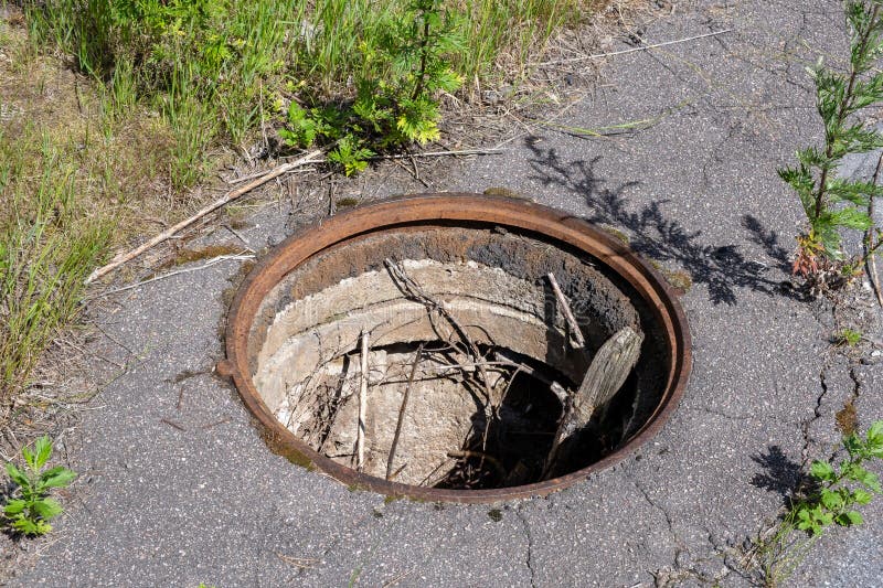 Open Hatch in an Abandoned Area Stock Photo - Image of metal, grass ...
