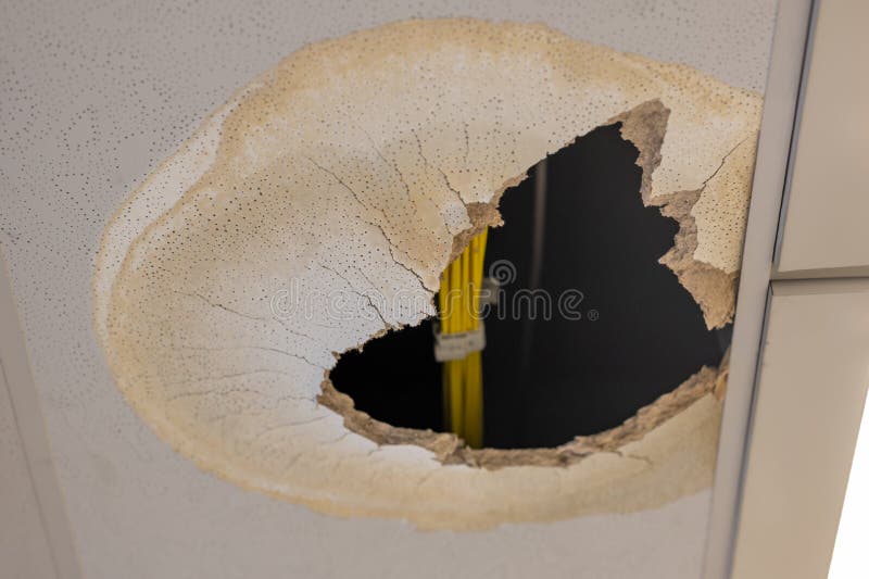 An Open Hole in the Ceiling Caused by a Water Damage. Stock Image ...