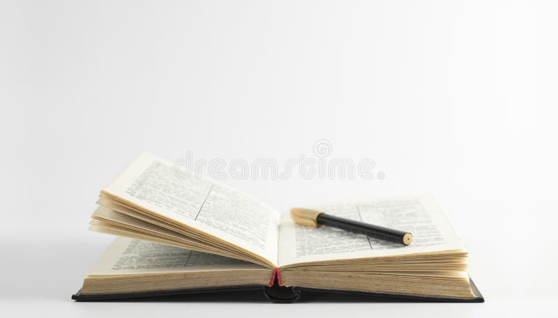 Open Holy Bible Book on the Table. Scripture. a Pen Stock Image - Image ...