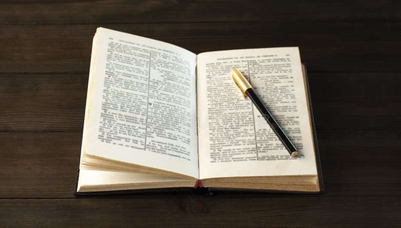 Open Holy Bible Book on the Table. Scripture. a Pen Stock Photo - Image ...
