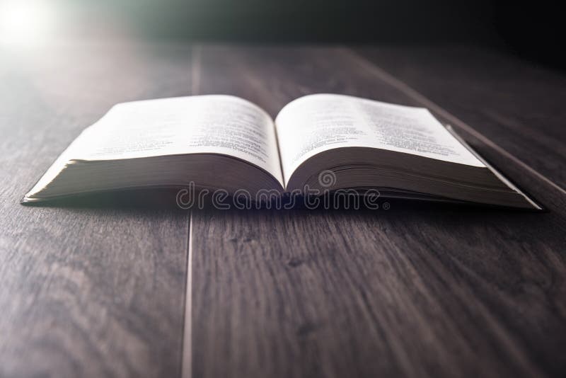 Open Holy Bible on table stock image. Image of retro - 220426129