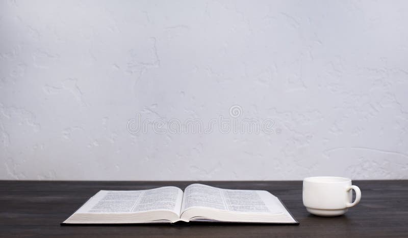 Open Holy Bible, on the Table. Prayer. a Cup of Coffee Stock Image ...
