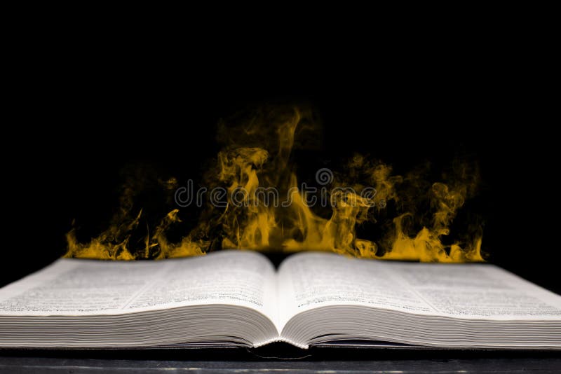 Open Holy Bible, on the Table. Prayer. Fire from the Book Stock Image ...