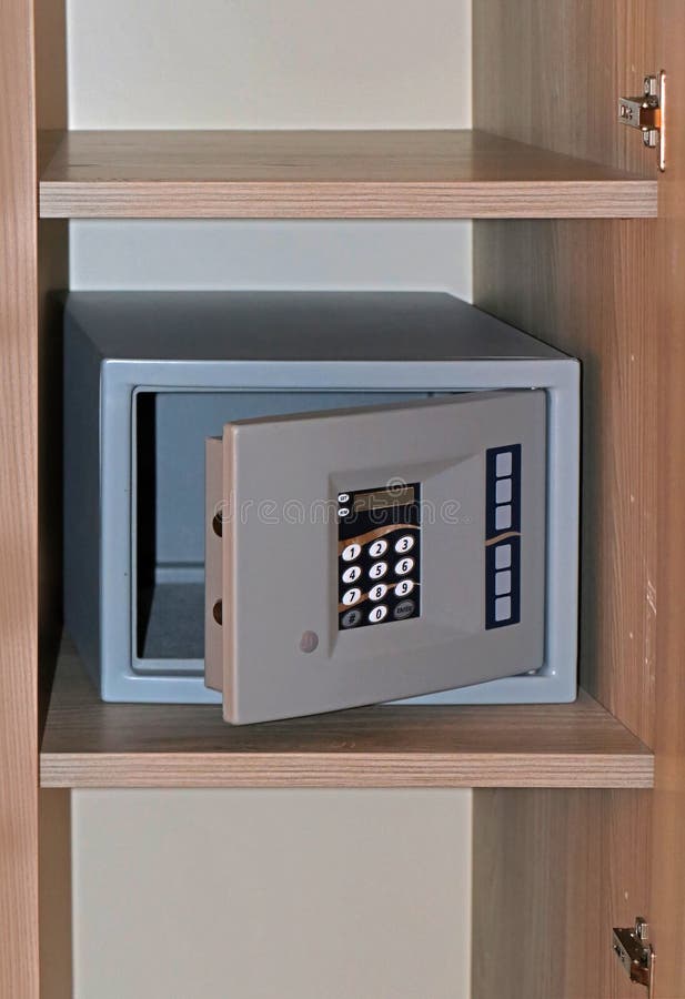 Open hotel safe on shelf stock image. Image of furniture - 210351431