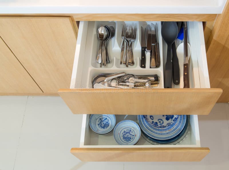 Open kitchen drawer stock image. Image of interior, plate - 70185427