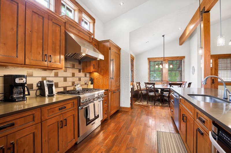 Open Kitchen Design with Vaulted Ceiling and Hardwood Floor. Stock ...