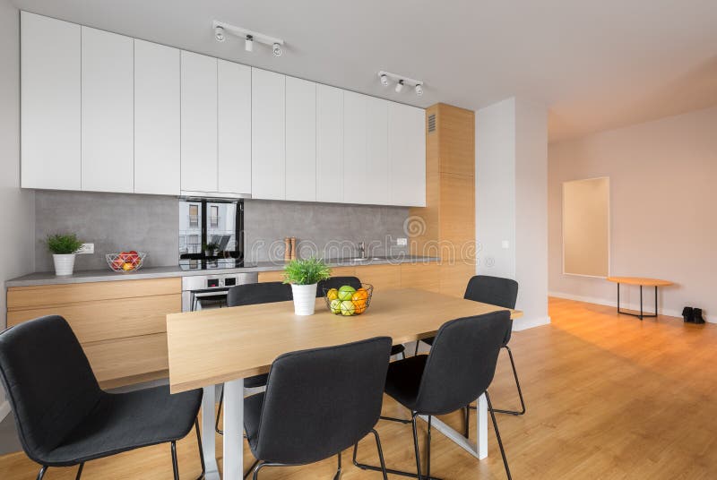Open Kitchen with Wooden Table Stock Image - Image of chairs, cupboards ...