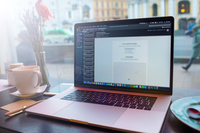 Open Laptop Computer with Blurred Programs on the Screen Lying on ...