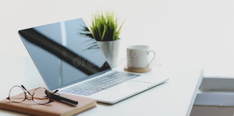 Open Laptop Computer with Coffee Cup and Office Supplies in Comfortable ...