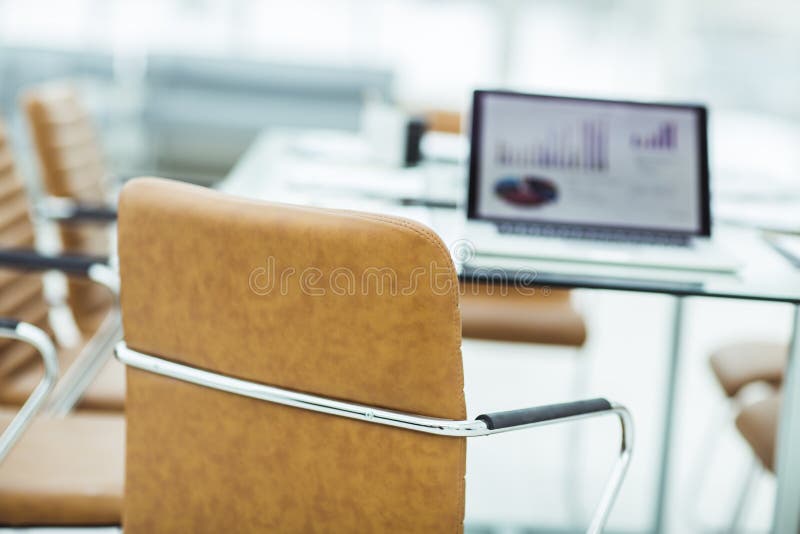 Open Laptop Computer with Financial Charts on the Table with the ...