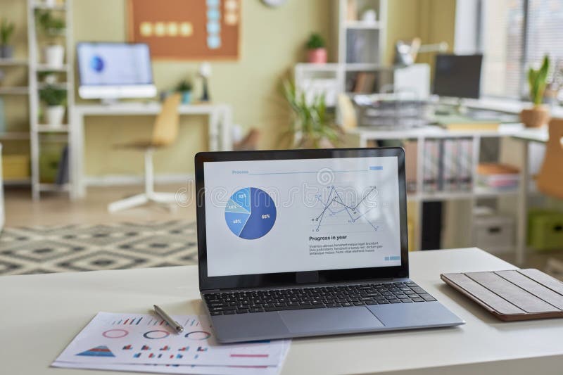 Open Laptop Computer with Statistics Data Graphs on Screen Stock Photo ...