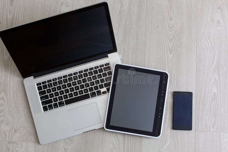 Open Laptop with Digital Tablet and Smartphone on Desk. Stock Image ...