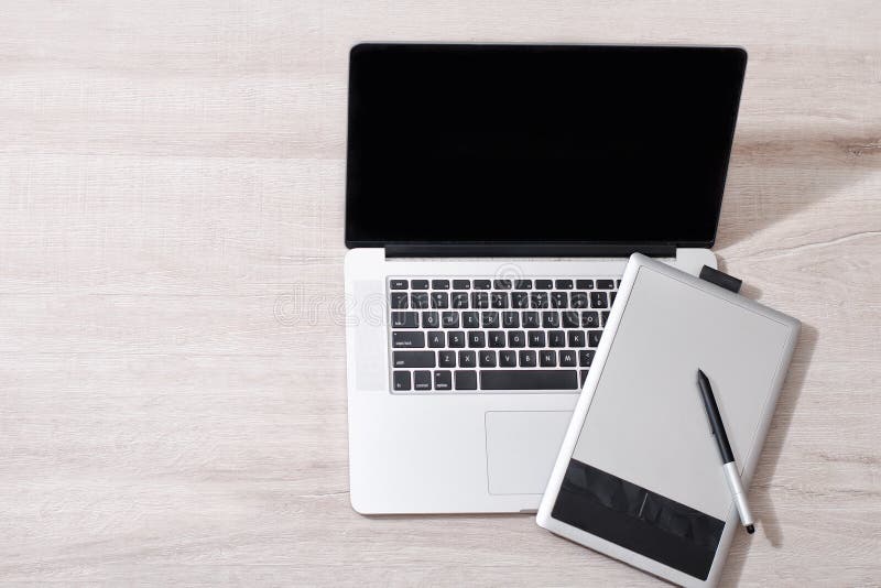 Open Laptop and Graphics Tablet on a Light Table, Top View Stock Photo ...