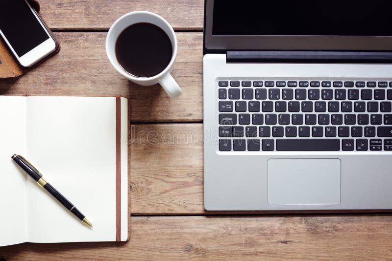 Open Laptop with Notepad and Smartphone on Desk from Above Stock Image ...