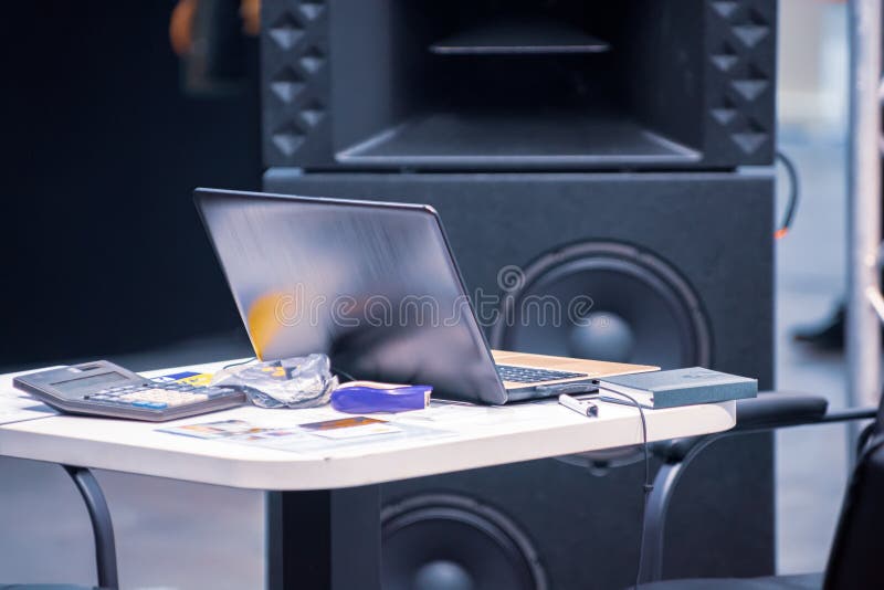 Open Laptop Screen Behind Desktops in Office Stock Image - Image of ...