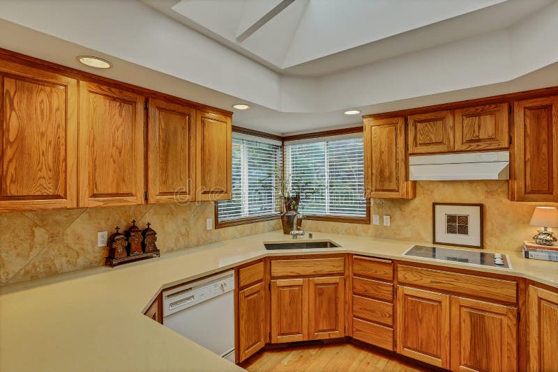 Open Large Kitchen Interior with Vaulted Ceiling and White Appliances ...