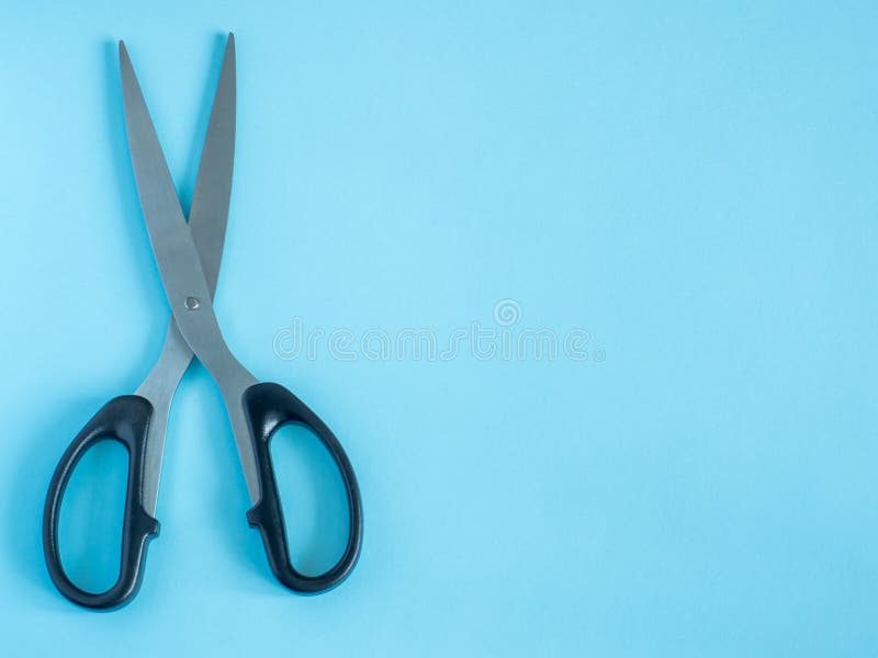 Open a Large Pair of Scissors on a Blue Background Stock Image - Image ...