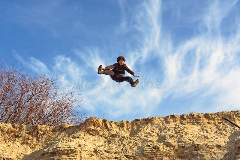 Open-leg jump from sand stock photo. Image of crazy, brave - 3345456