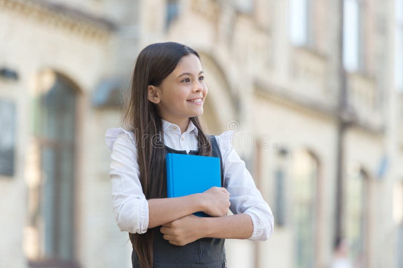 Open Lesson. Little Child Hold Lesson Book Outdoors. Back To School ...