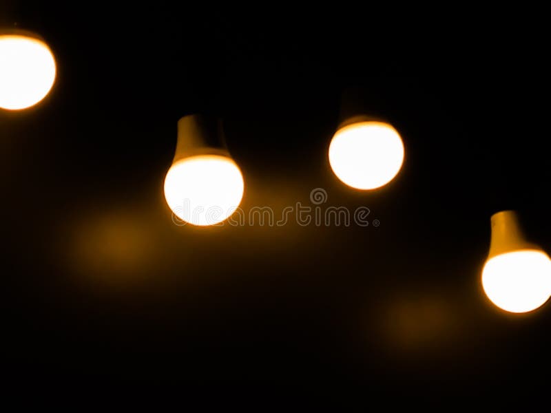 Open Orange Light Bulb on Black Background Stock Photo - Image of ...