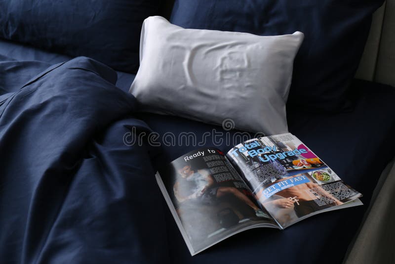 Open Magazine on Bed with Stylish Silky Linens Stock Photo - Image of ...