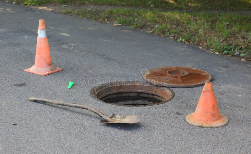 An Open Manhole Protected by Restrictive Cones Stock Photo - Image of ...