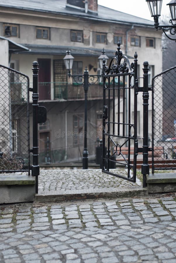 Open Metal Gate in the Old City Stock Photo - Image of buildings ...