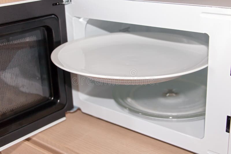 An Open Microwave with a Empty White Plate. Stock Image - Image of cook ...