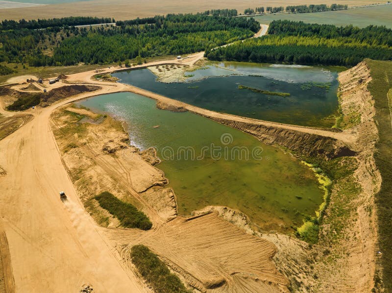 Open Mining of Constructing Sand from Illuminated Quarry Stock Photo ...