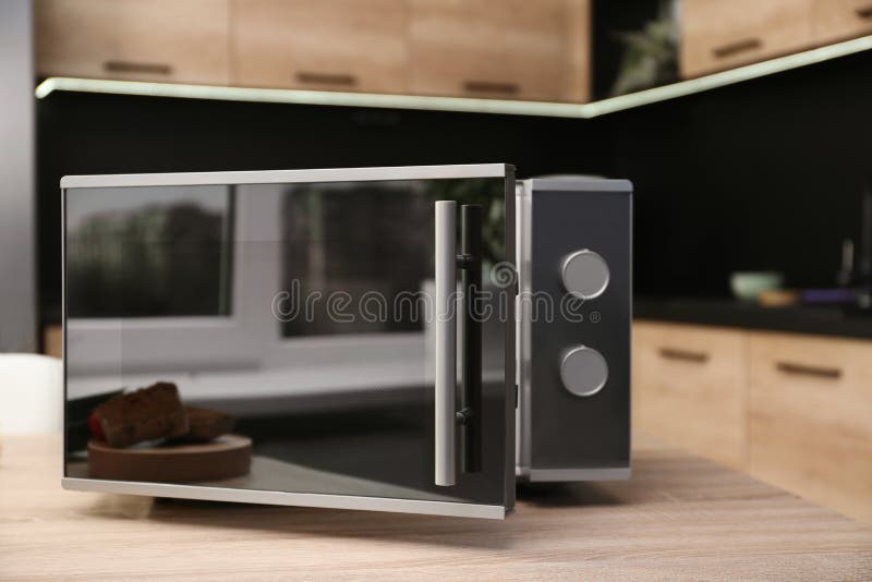 Open Modern Microwave Oven on Table Stock Photo - Image of kitchen ...