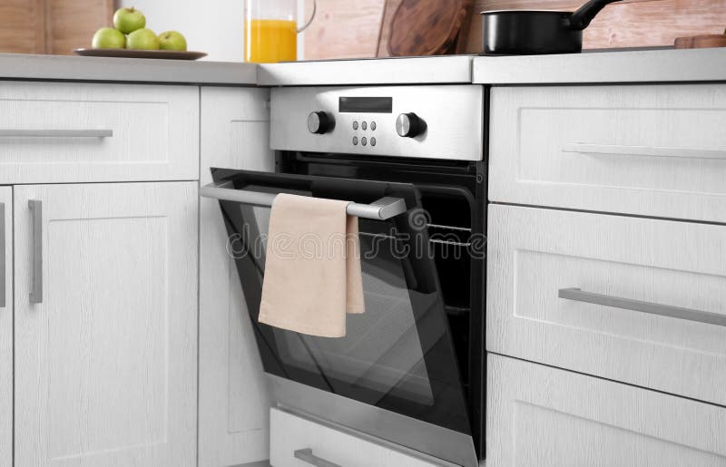 Open modern oven built stock photo. Image of cabinet - 130562132