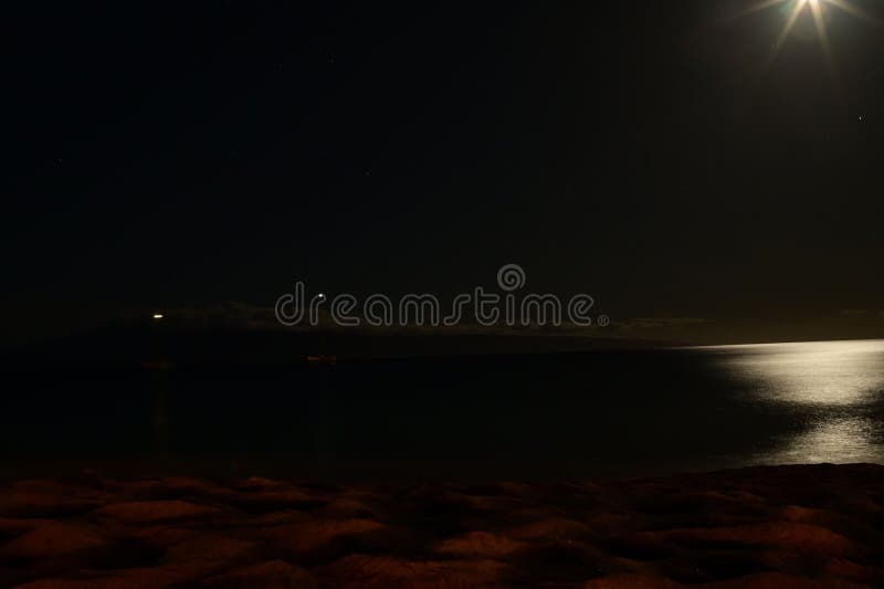 An Open Night Sky with a Large Moon and the Surface Lit Up Stock Image ...
