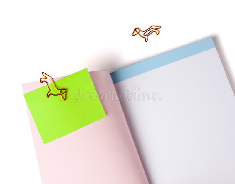 An Open Notebook or Book with Blank Pages with Note Paper Attached with ...