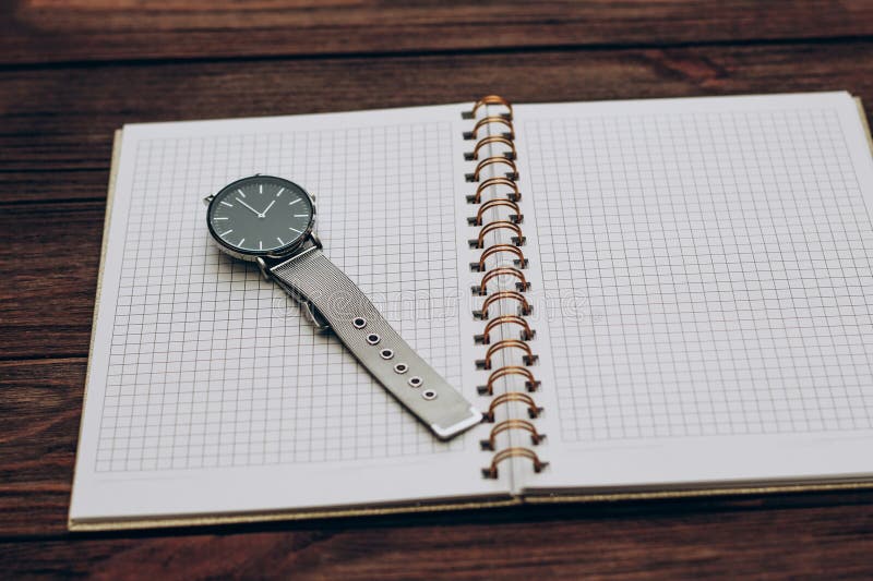Open Notebook Diary with Clock with Black Dial, Time Management Concept ...