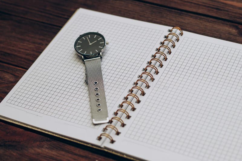 Open Notebook Diary with Clock with Black Dial, Time Management Concept ...