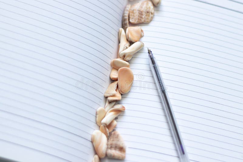 An Open Notebook, Diary or Planner Containing an Open Blue Pen with ...