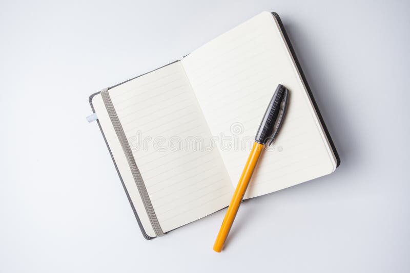 Open Notebook with an Orange Ballpen on it Stock Image - Image of ...