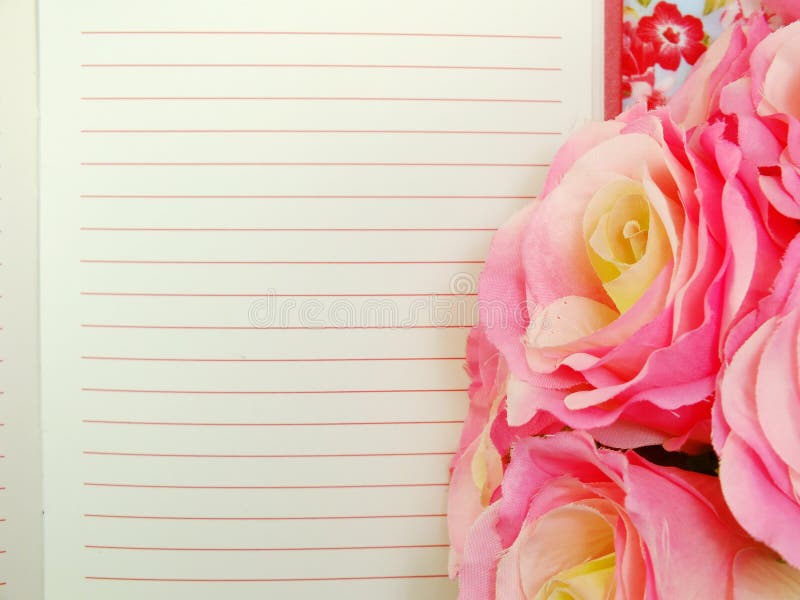 Open Notebook Paper with Red Lines and Artificial Roses Flower Stock ...