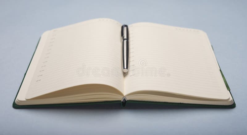 Open Notebook with Silver Pen on Office Desk, Side View, Close Up Stock ...