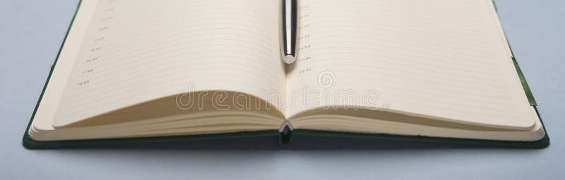 Open Notebook with Silver Pen on Office Desk, Side View, Close Up Stock ...