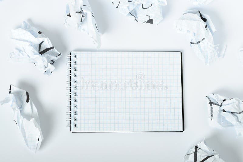 Open Notebook Surrounded by Crumpled Sheets of Paper. Stock Image ...