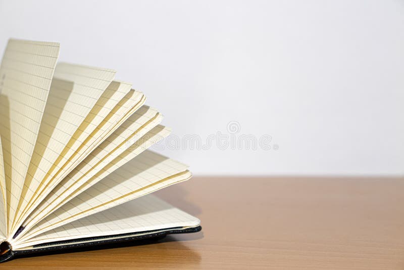 Open Notebook on a Wooden Table Stock Photo - Image of black, retro ...