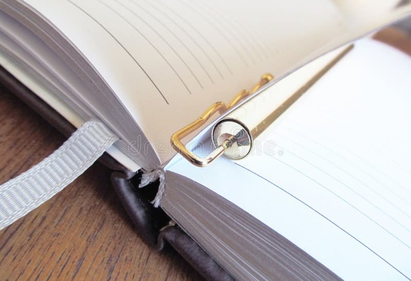 A Bookmark Pen in a Notebook Stock Photo - Image of book, business ...