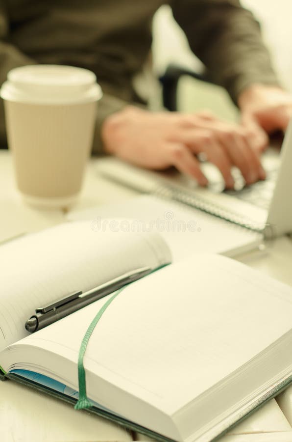 Open Notepad with Schedule on Work-table and Working Man on Background ...