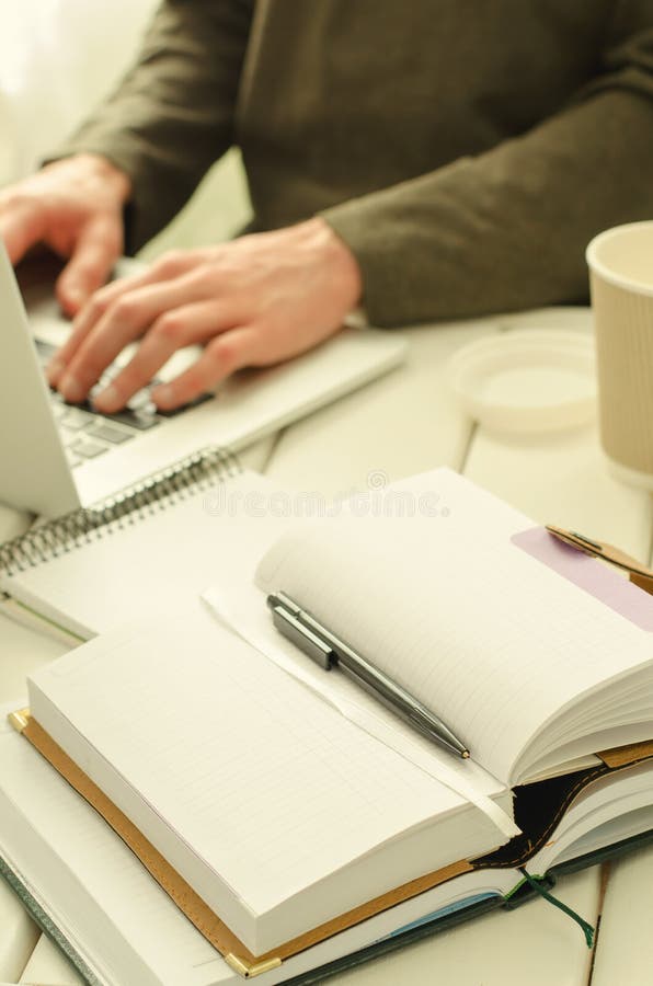 Open Notepad with Schedule on Work-table and Working Man on Background ...